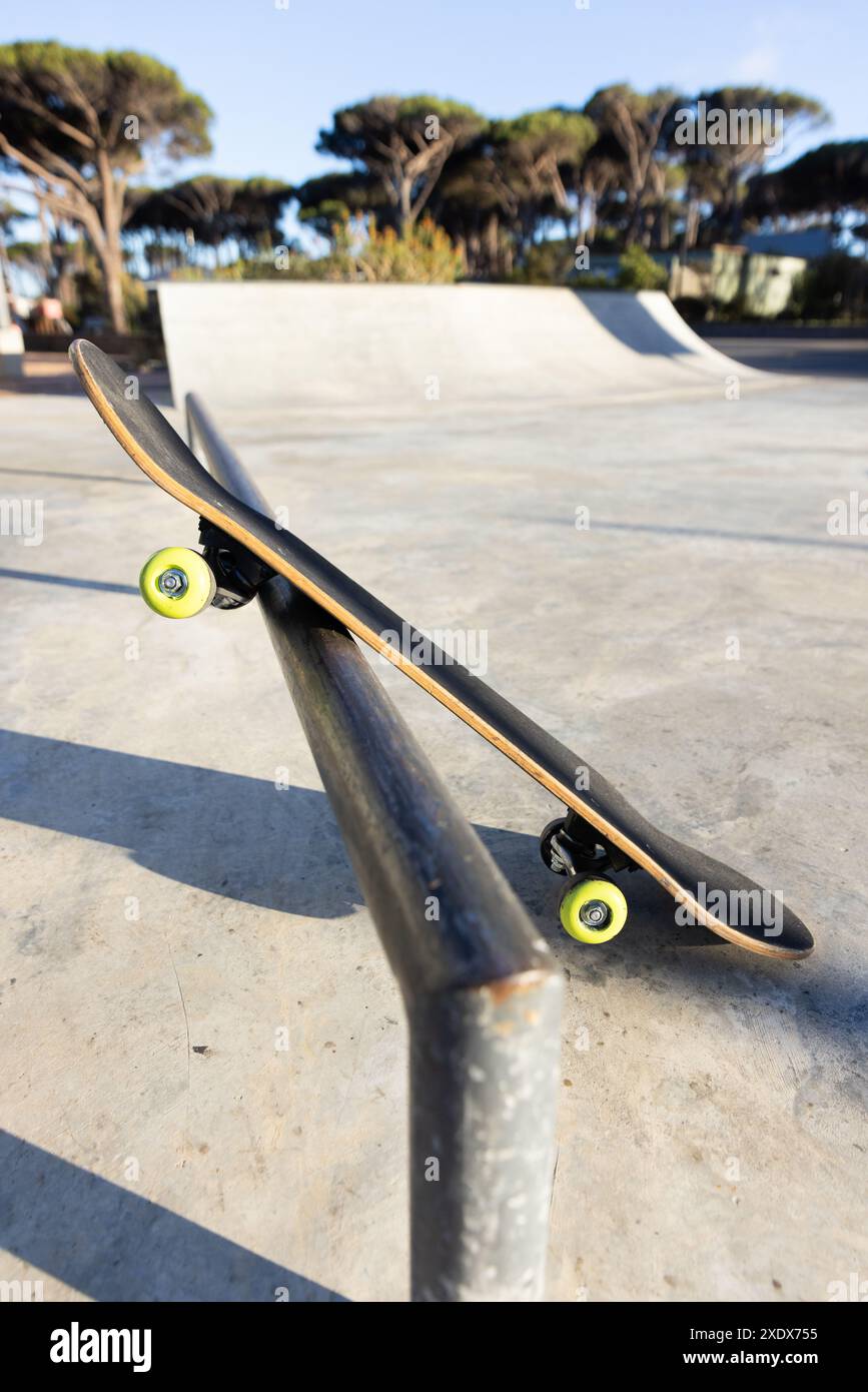 Skateboard balancing on rail at skatepark, ready for tricks and stunts ...