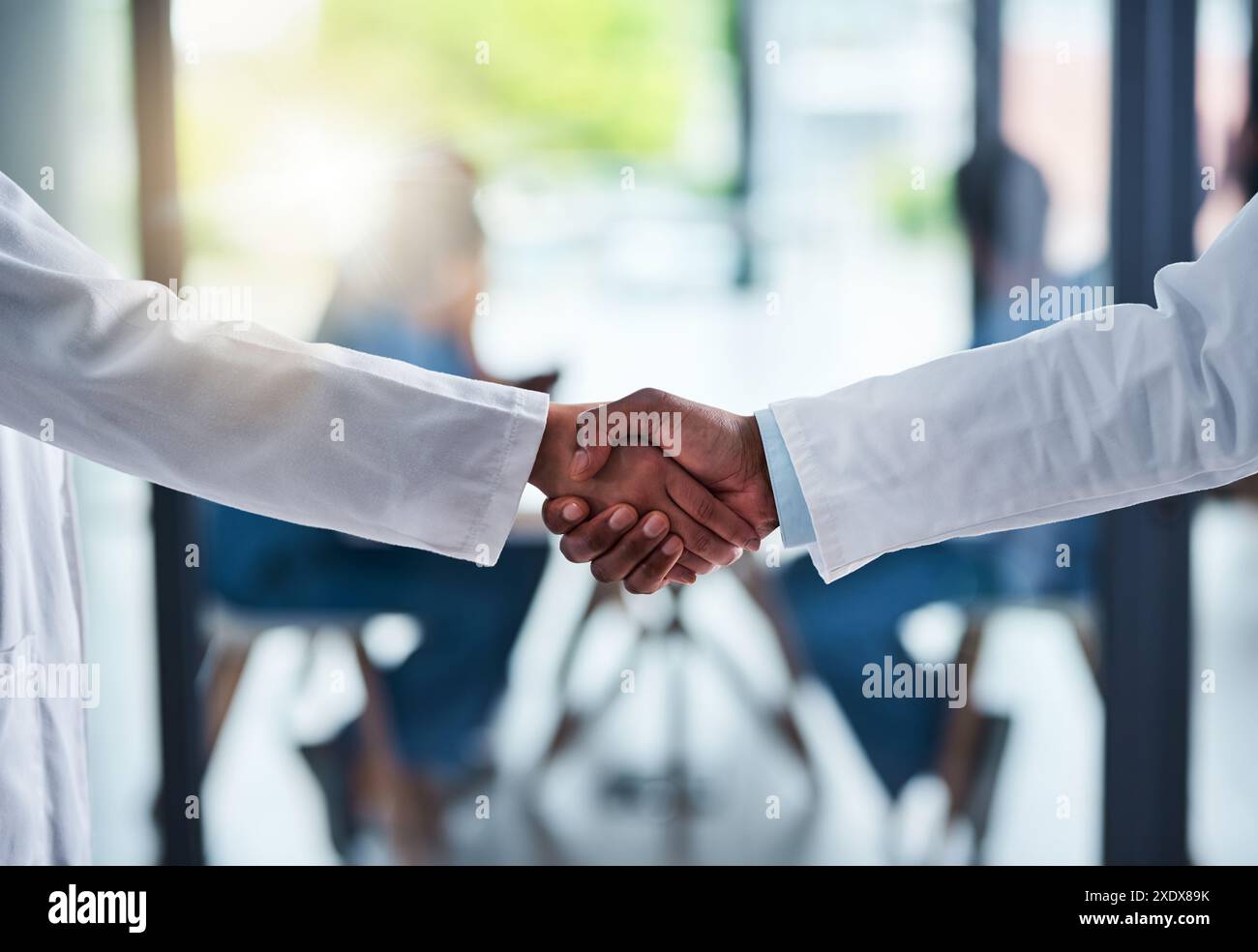 People, medical and doctors handshake in hospital, medicine and ...