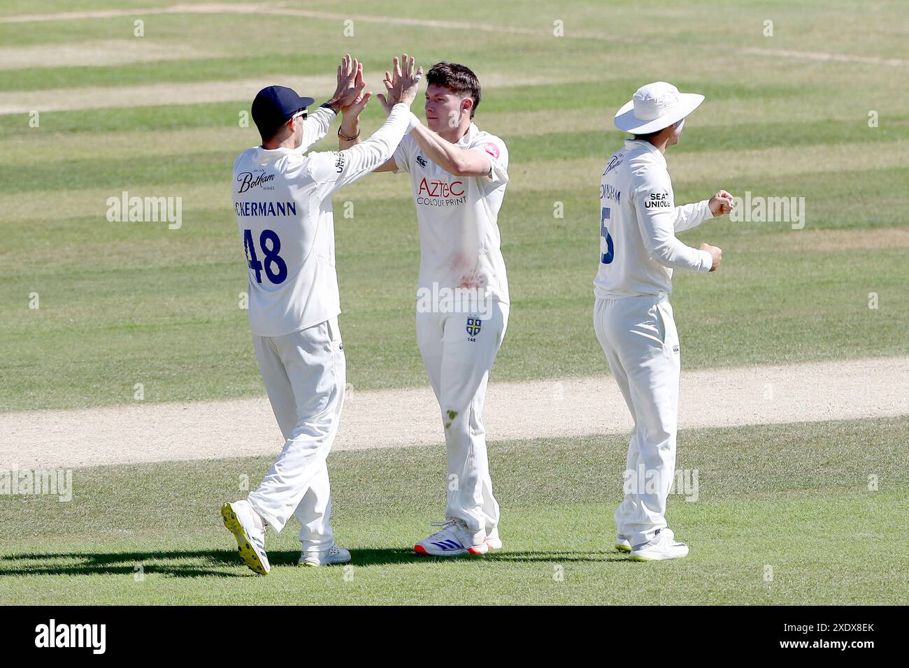 Matthew Potts of Durham celebrates with his team mates after taking the ...