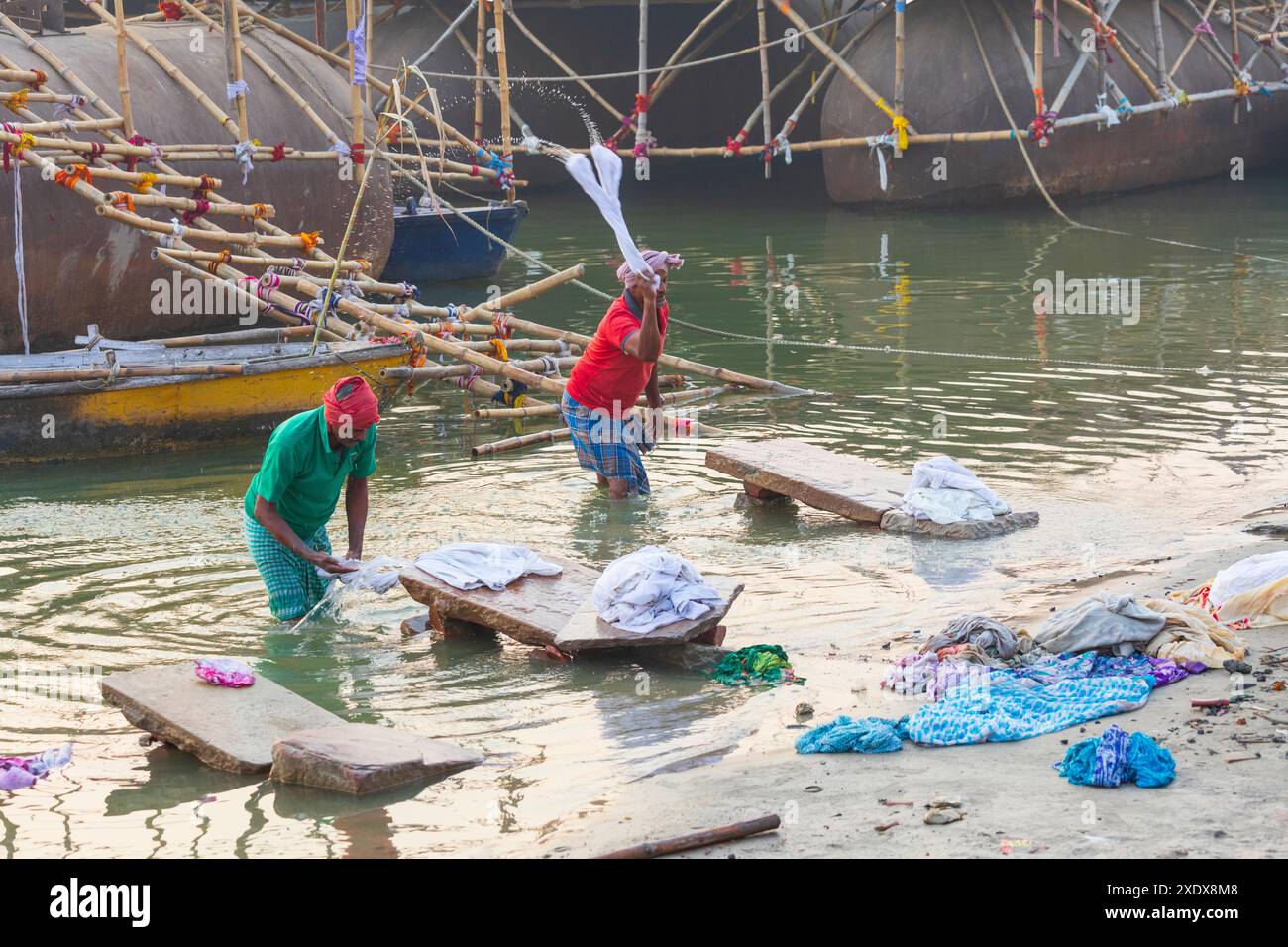 India, Uttar Pradesh, Varanasi, Bangali Tola. People washing clothes in ...