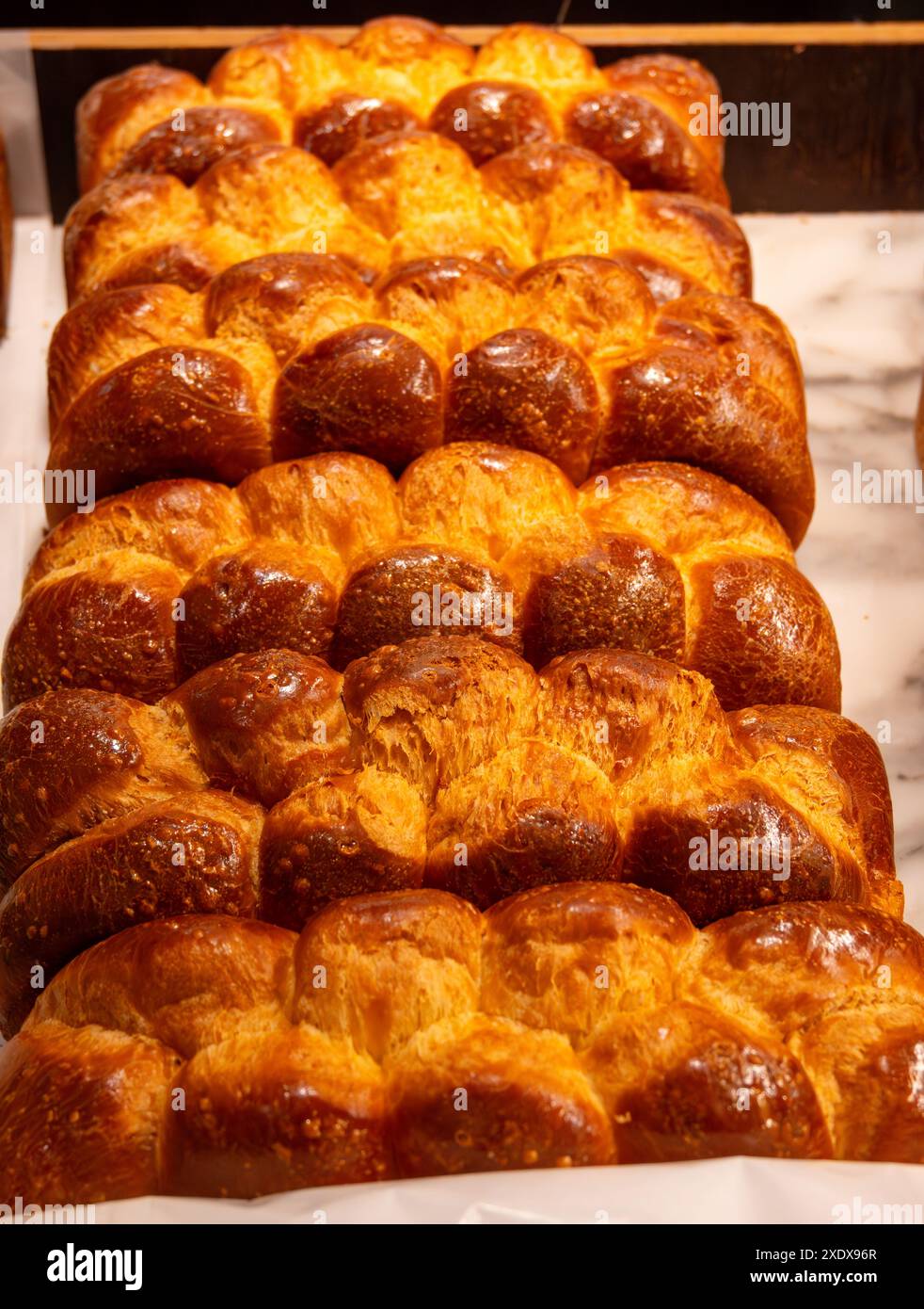 Traditional Jewish bread challah braided brioche bread in bakery close ...