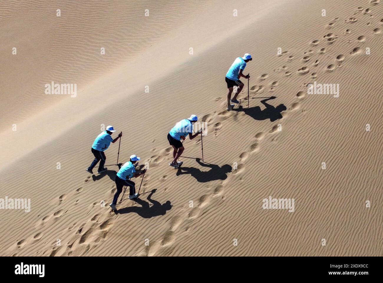 ORDOS, CHINA - JUNE 25, 2024 - Sports enthusiasts compete in the Desert ...