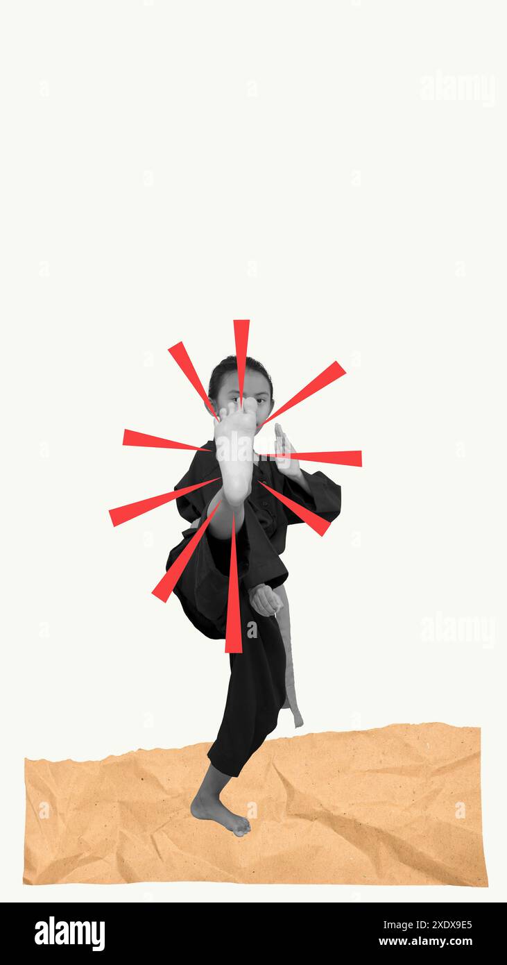 Young woman is practicing martial arts, executing a powerful kick with ...