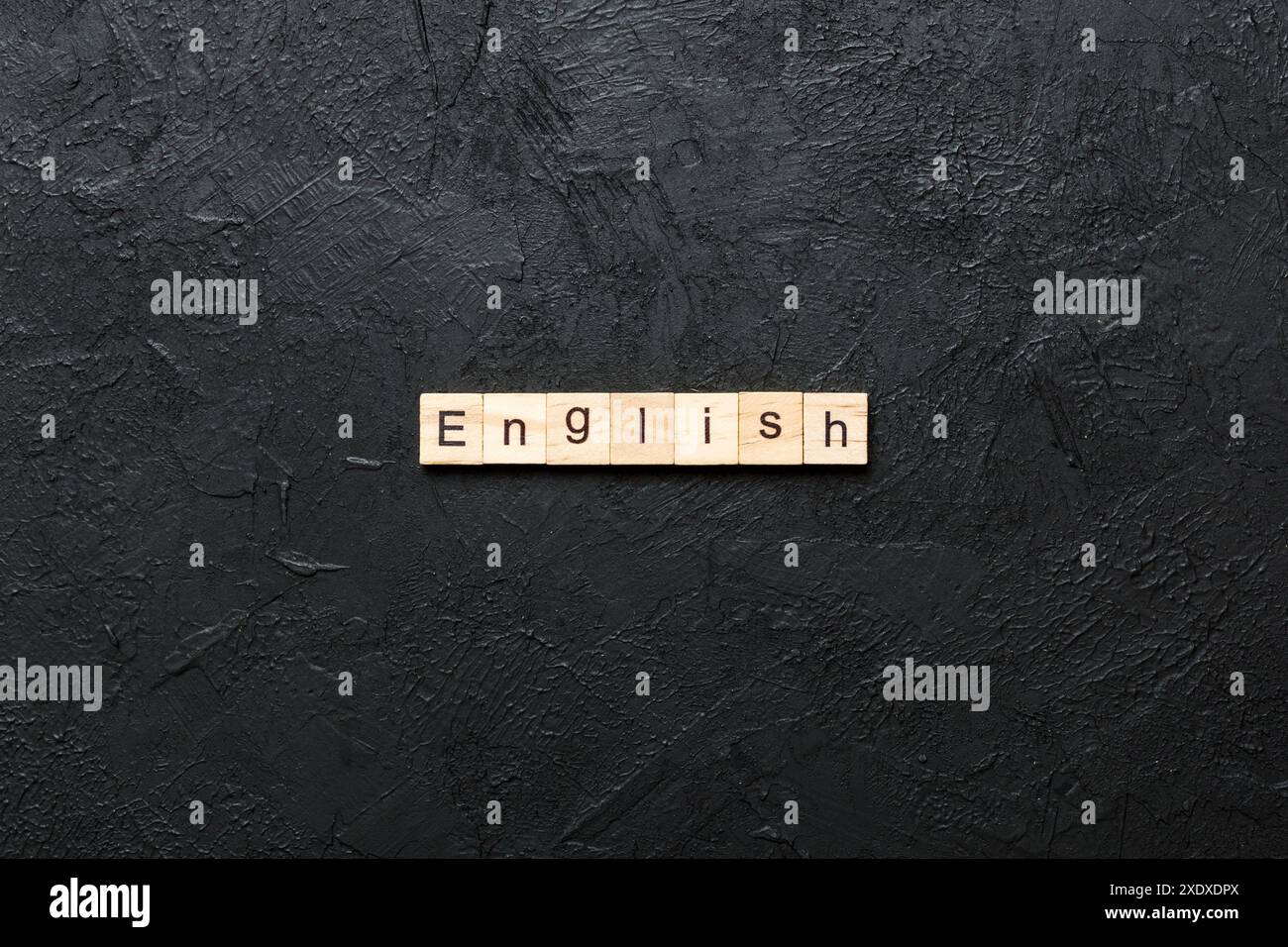 english word written on wood block. english text on cement table for ...