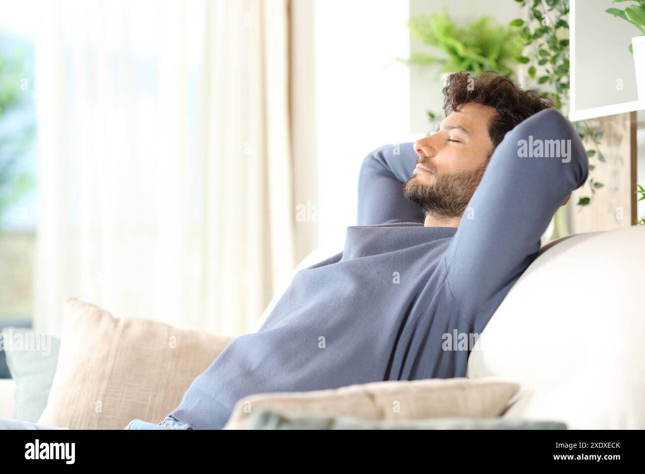 Side view portrait of a serious man resting and relaxing sitting on a ...