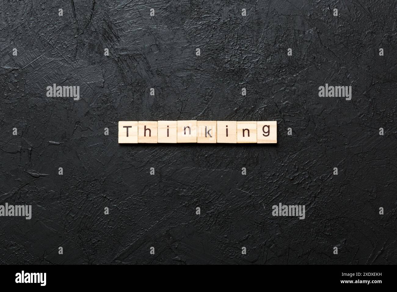 thinking word written on wood block. thinking text on cement table for ...