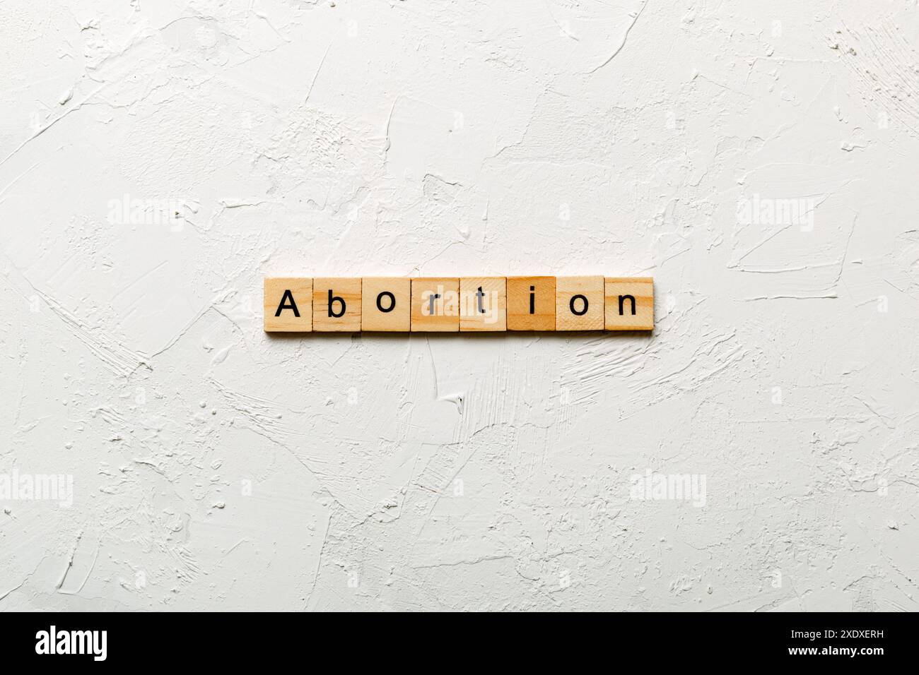 abortion word written on wood block. abortion text on table, concept ...