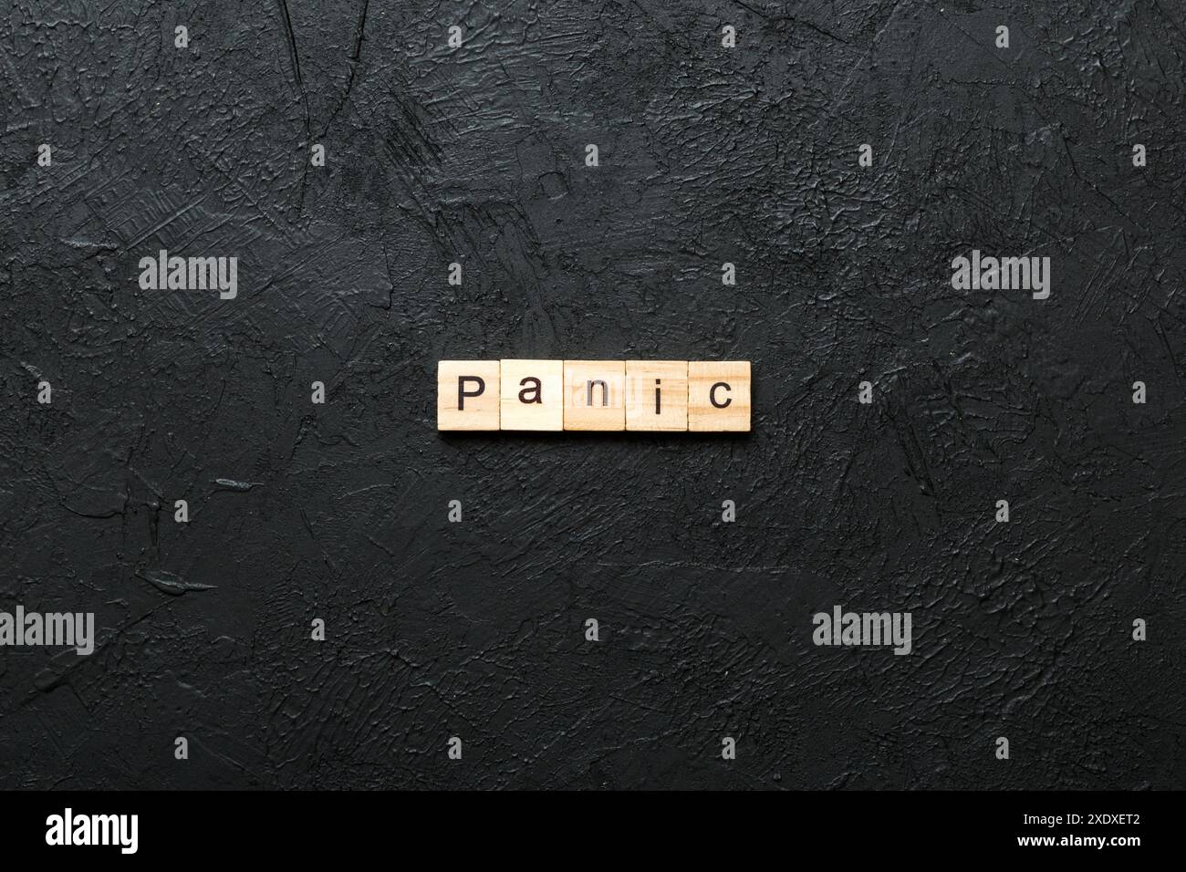 panic word written on wood block. panic text on table, concept Stock ...