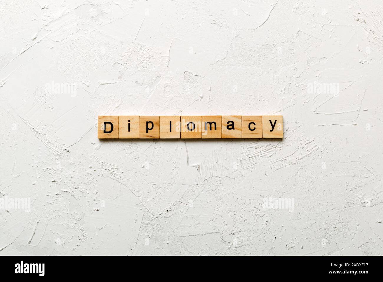 diplomacy word written on wood block. diplomacy text on cement table ...