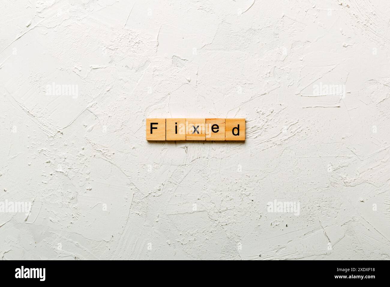 fixed word written on wood block. fixed text on table, concept Stock ...