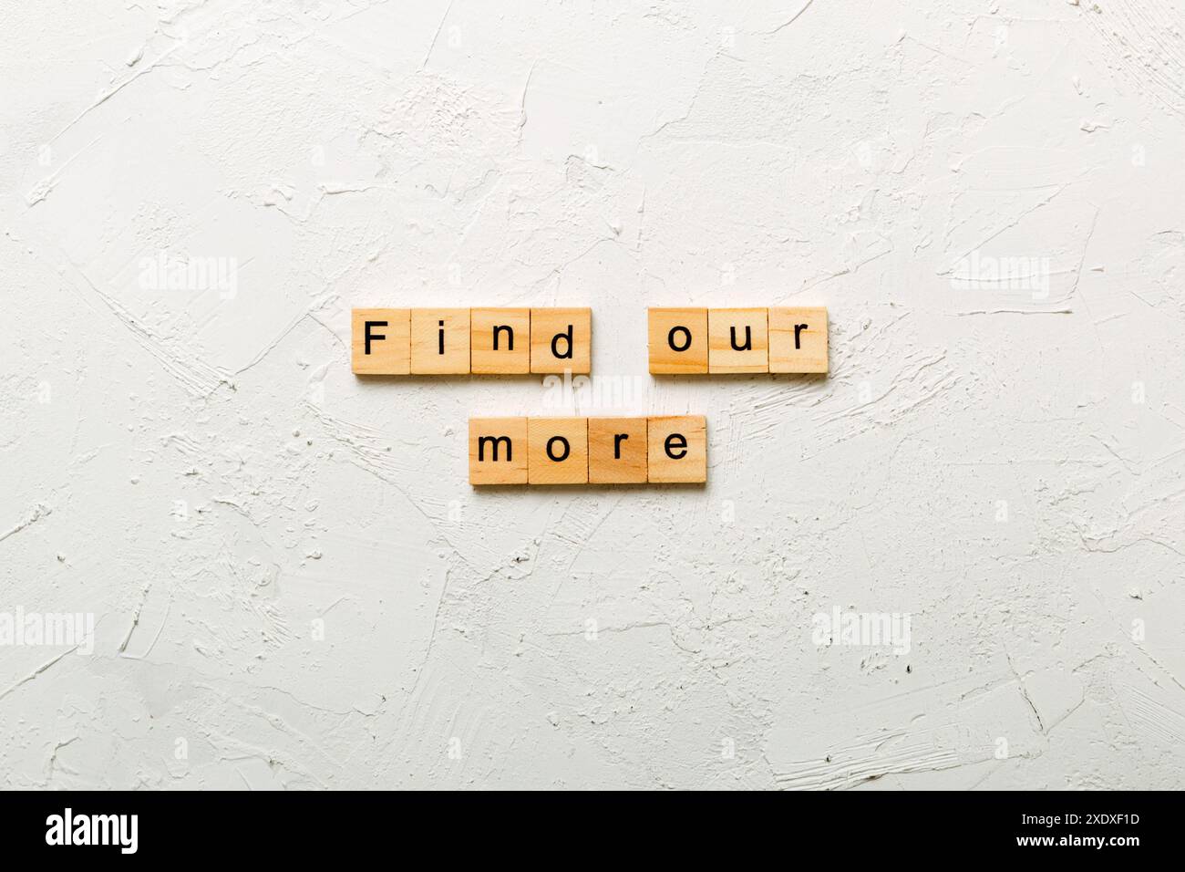 Find out more word written on wood block. Find out more text on cement ...
