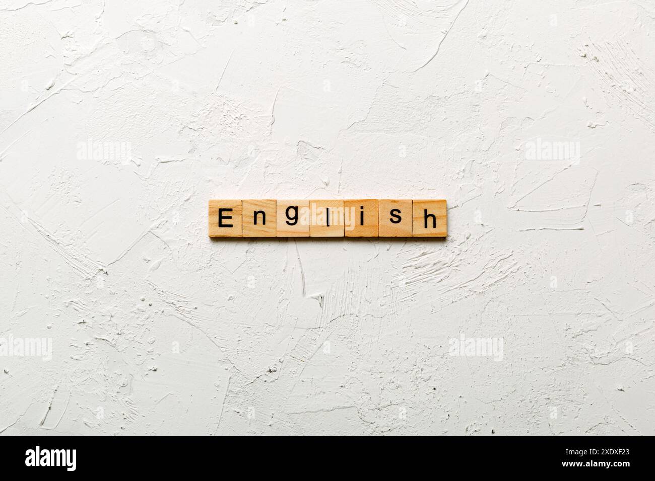 english word written on wood block. english text on cement table for ...