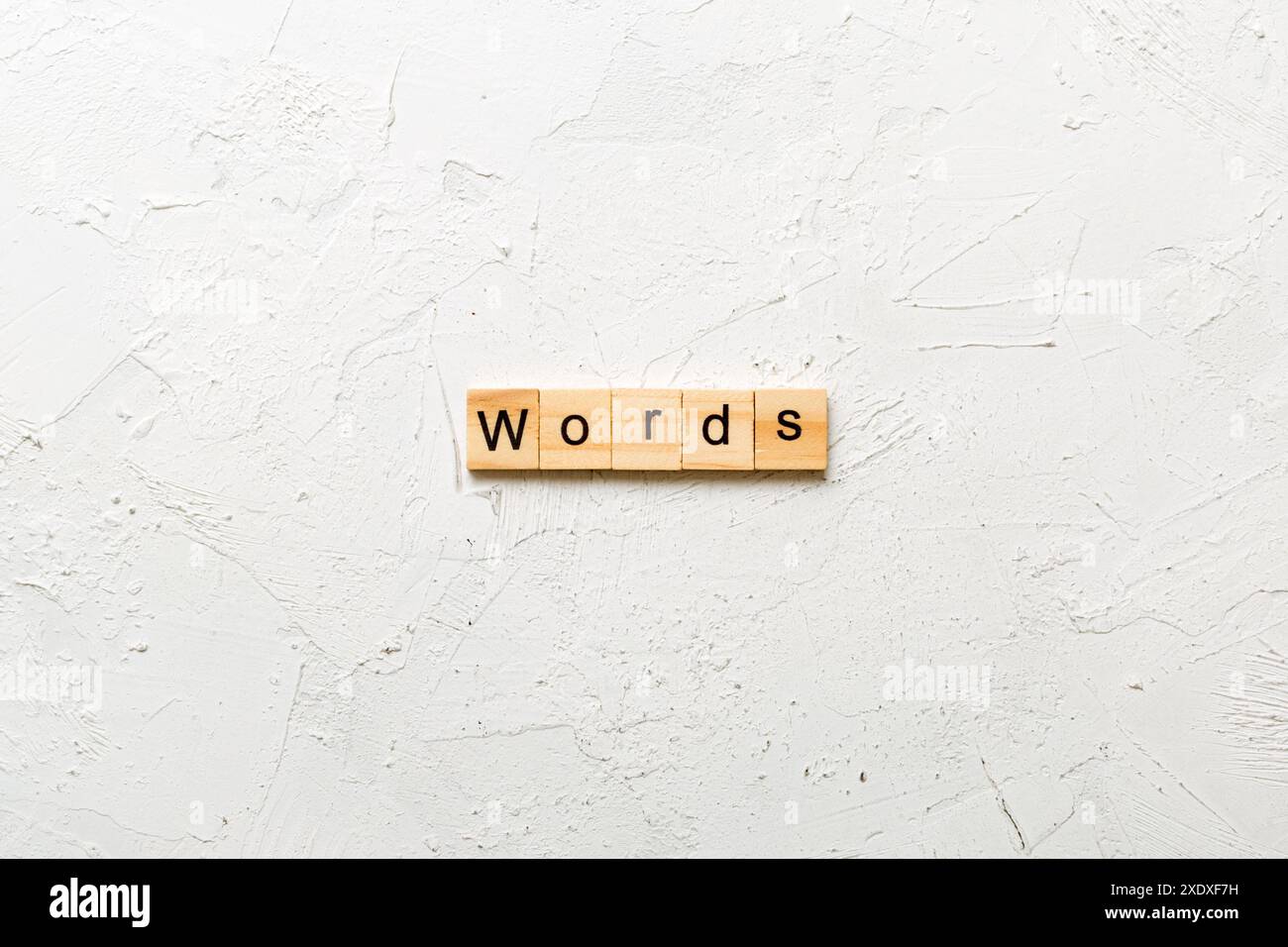 word written on wood block. WORD text on cement table for your desing, concept Stock Photo - Alamy