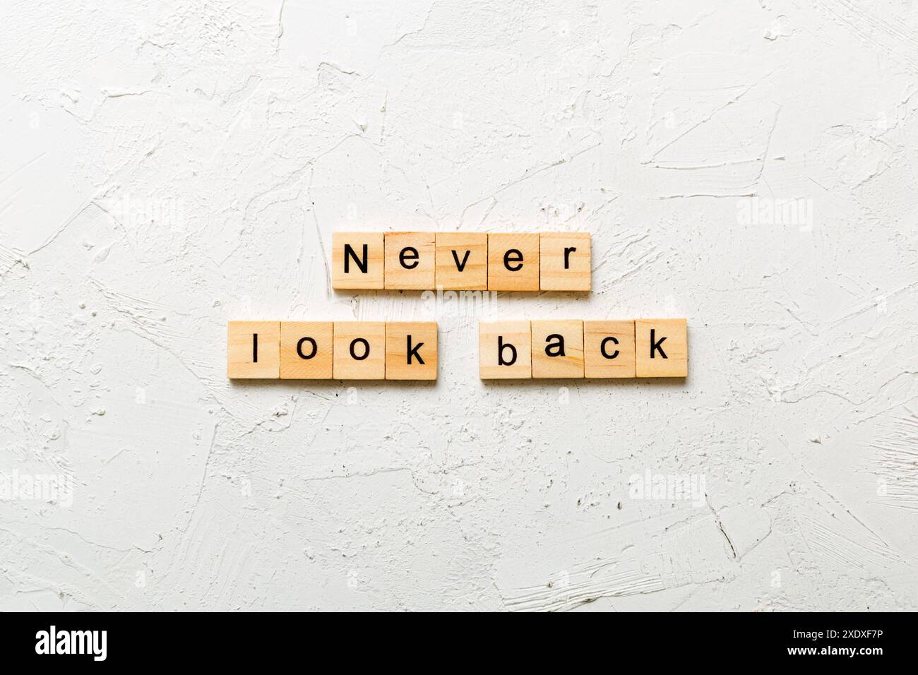 never look back word written on wood block. never look back text on ...