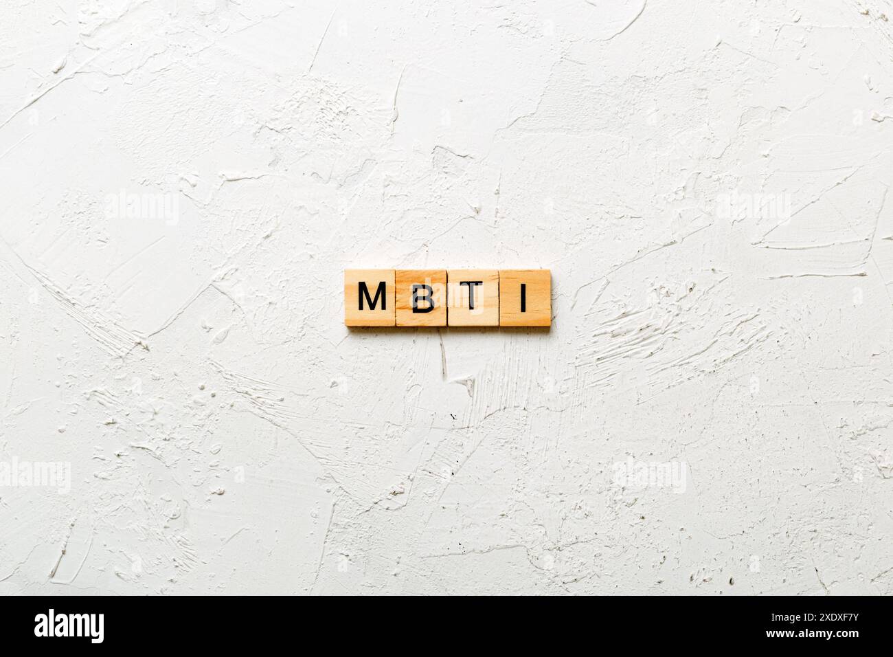 MBTI word written on wood block. Myers-Briggs Type Indicator text on ...