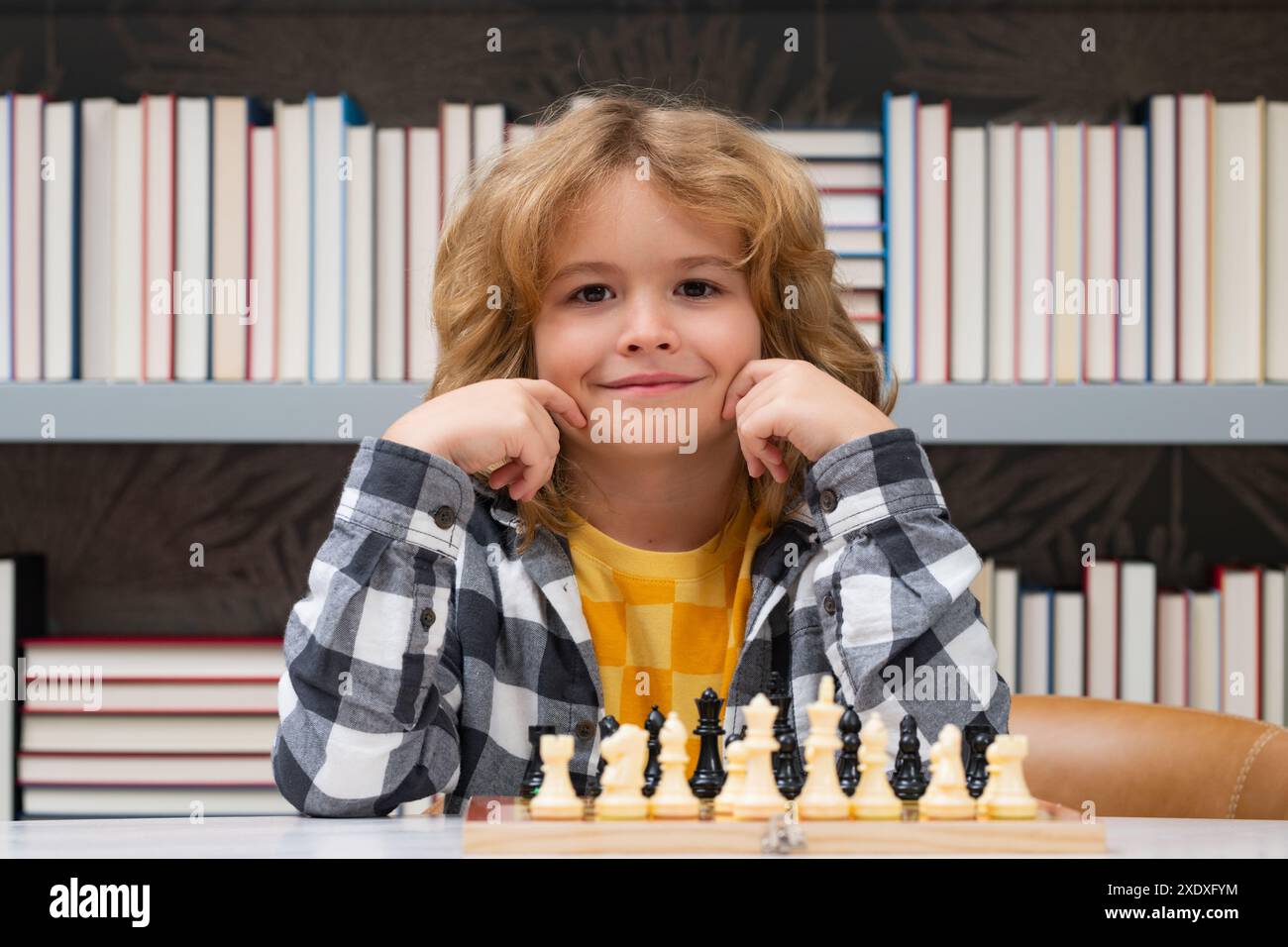 Kid play chess in classroom at school. Cute child playing chess. Child ...
