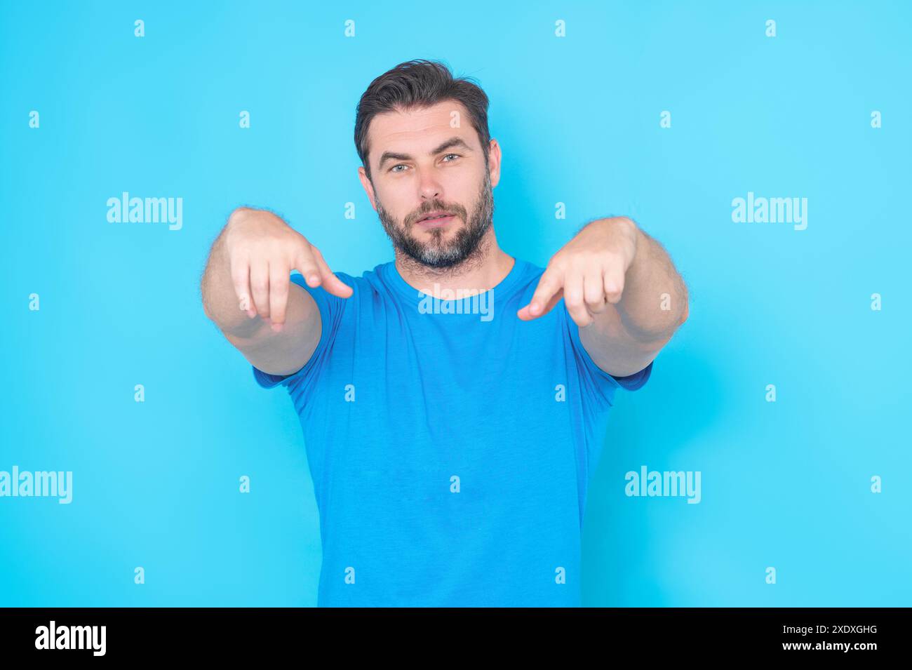 Gesture pointing finger at you. The point you. Happy handsome man ...