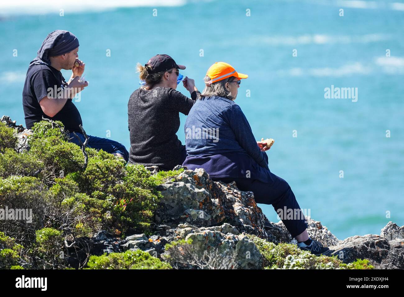 Friends relaxing on cliff having hi-res stock photography and images ...