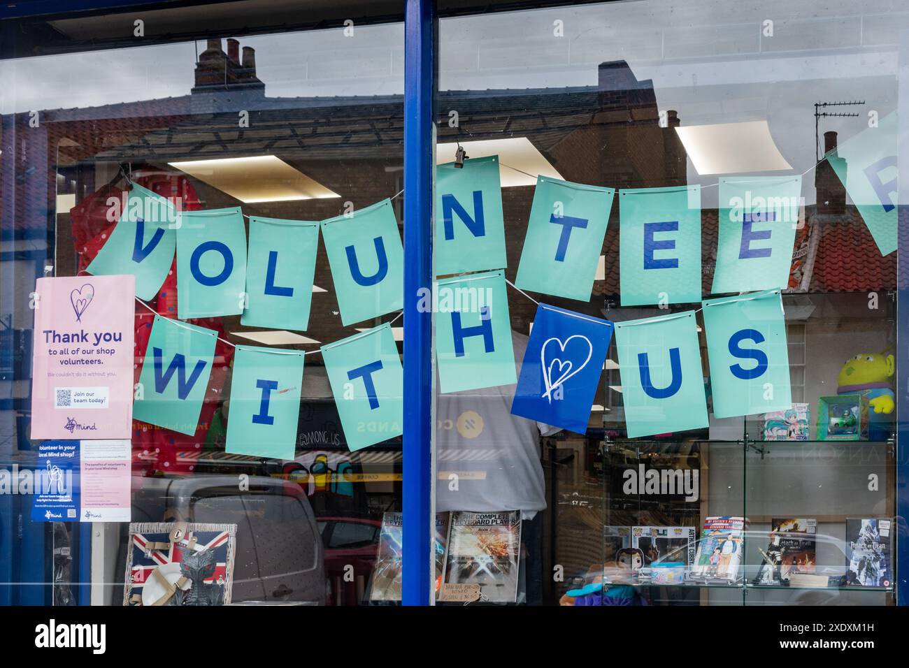 Volunteer with us sign in a charity shop window, Mind Charity shop ...