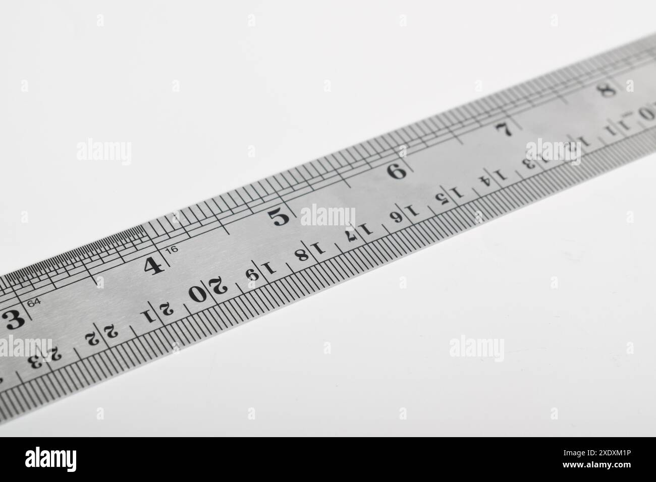 Iron ruler on a white background. Stainless steel ruler. Stationery and ...