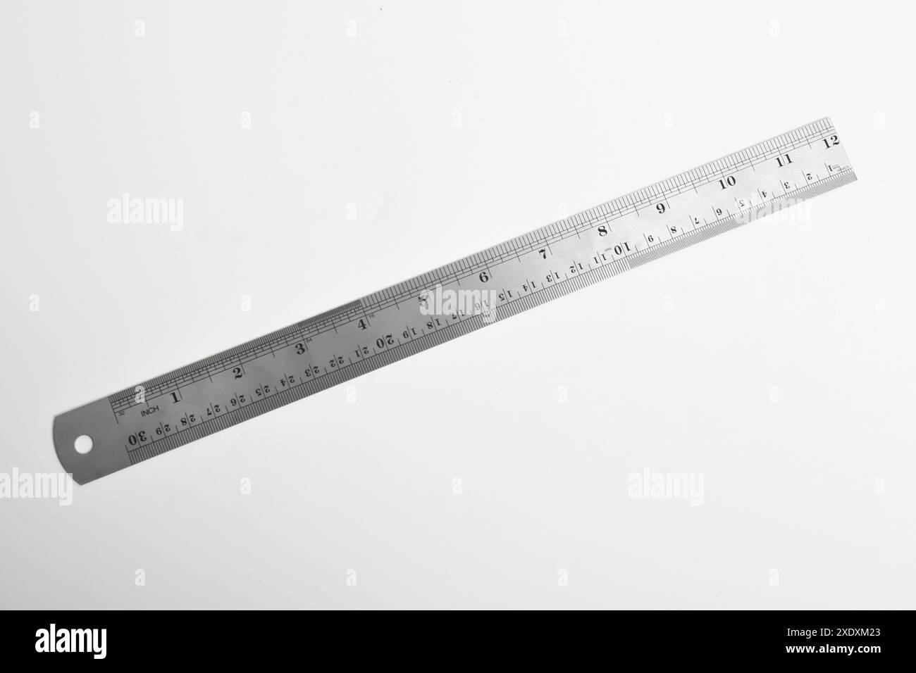 Iron ruler on a white background. Stainless steel ruler. Stationery and ...