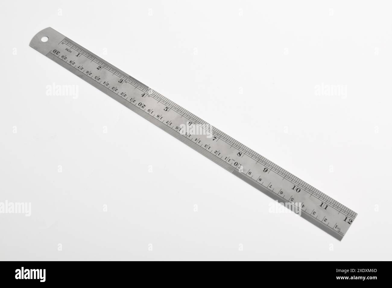 Iron ruler on a white background. Stainless steel ruler. Stationery and ...