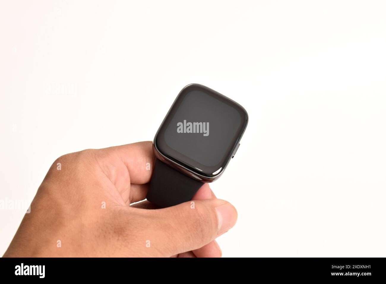 Hand holding Wireless Smart watch isolated on white background. Black ...