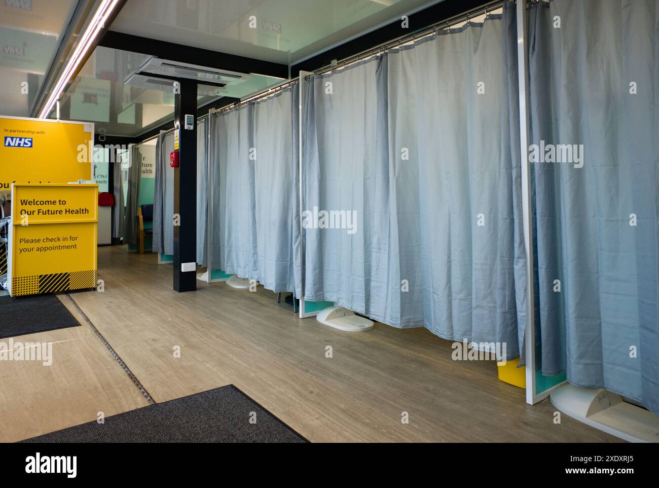 NHS Our Future Health screening van interior with closed off booths ...