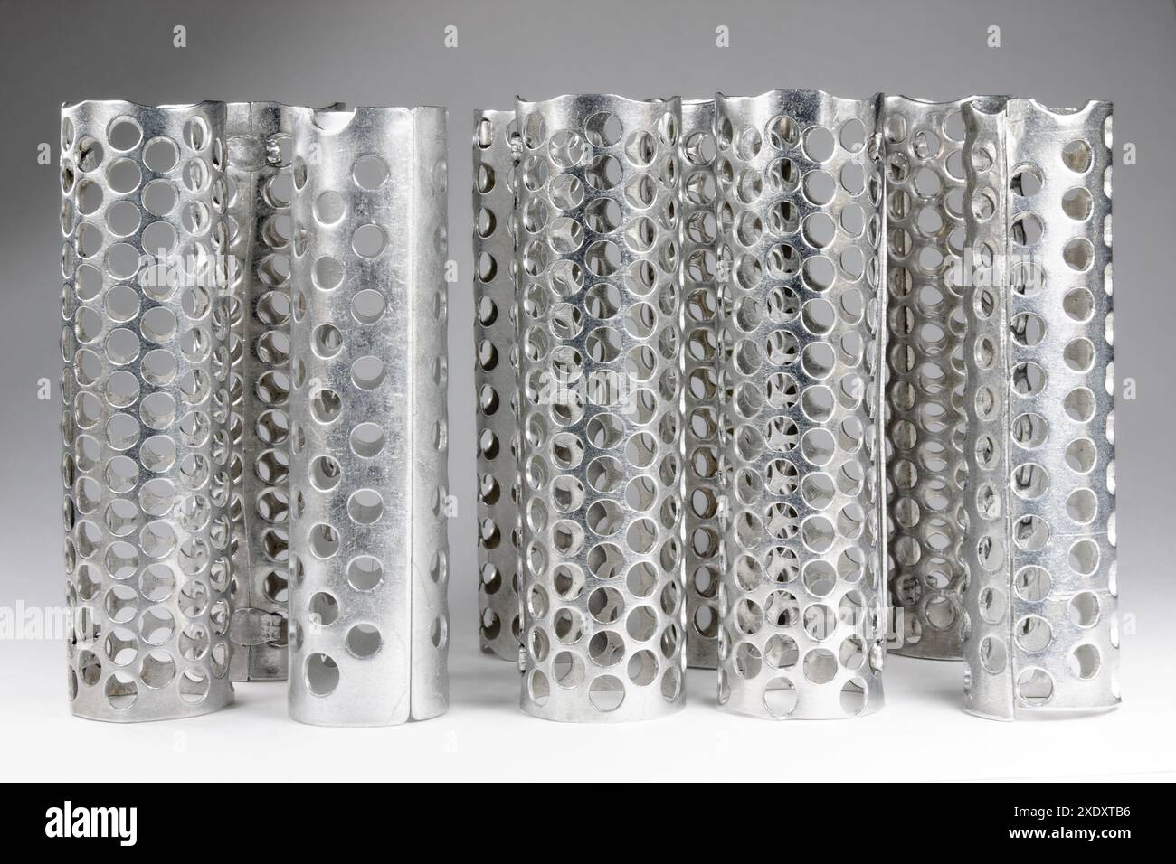 Metallic curlers in rows Stock Photo - Alamy