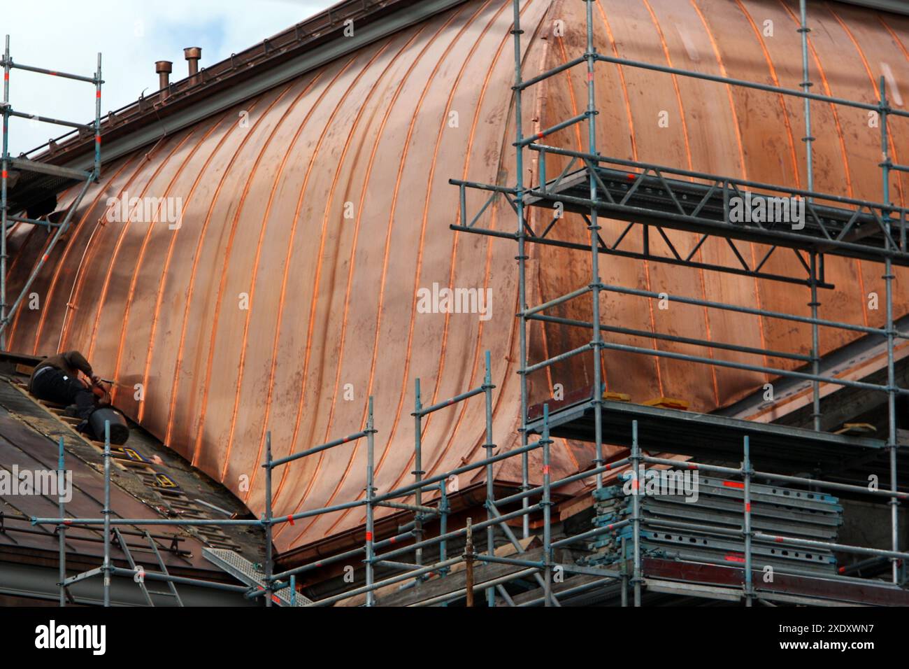 Man at work on copper roof Stock Photo - Alamy