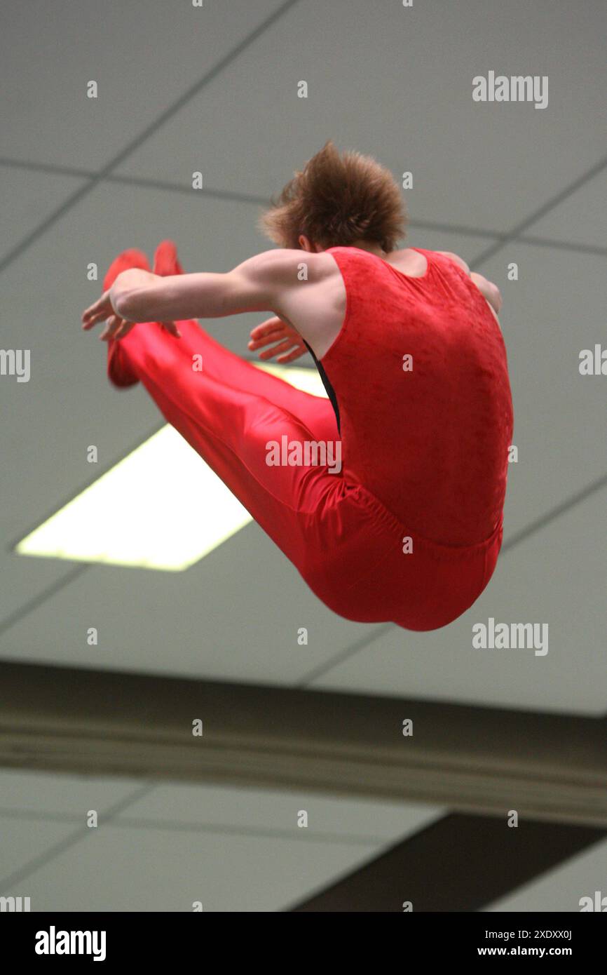 Trampoline gymnastics in the air Stock Photo - Alamy