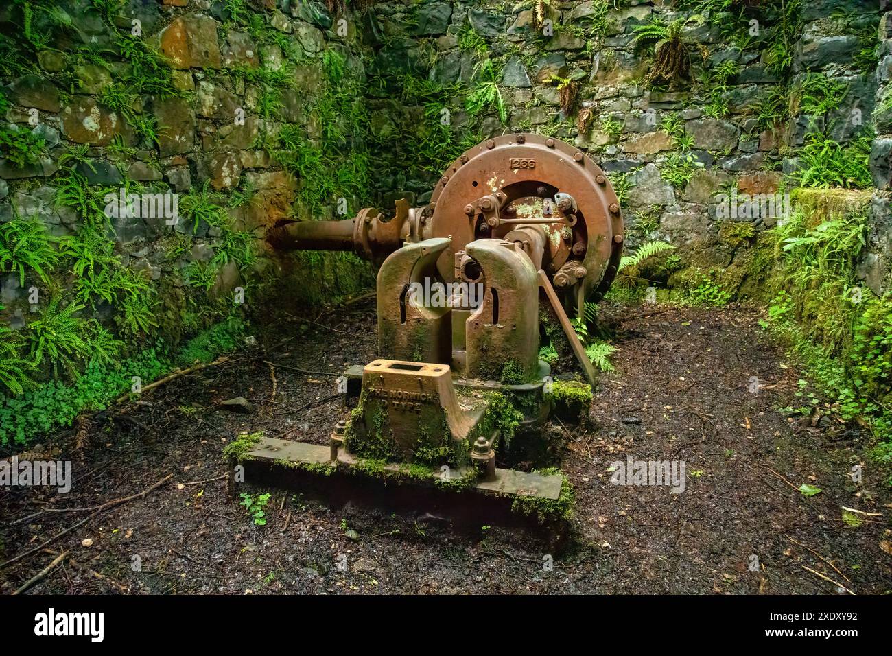 Antique rusted old water pump in brick pump room Stock Photo - Alamy