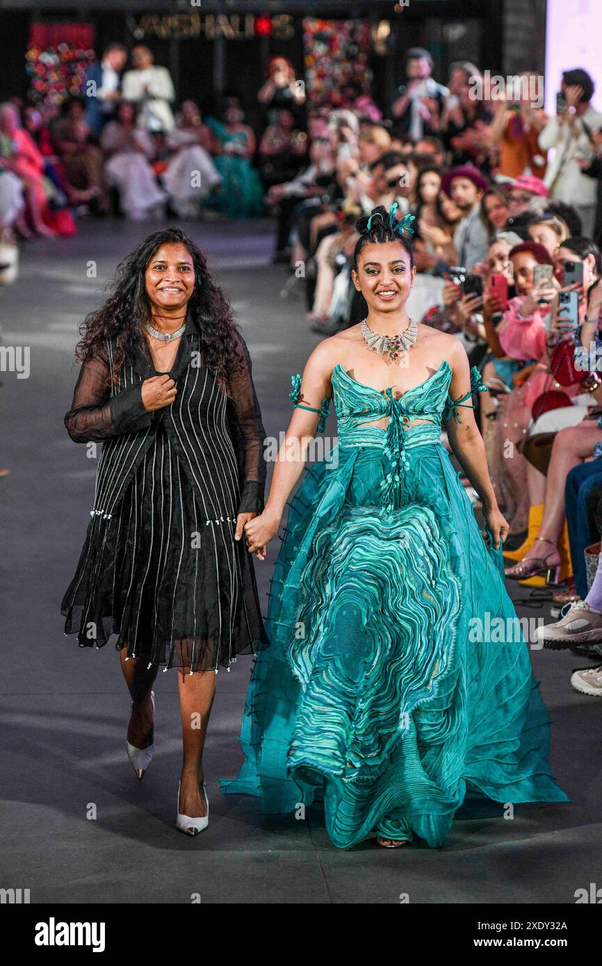 Designer Vaishali Shadangule acknowledges audience on the runway during ...