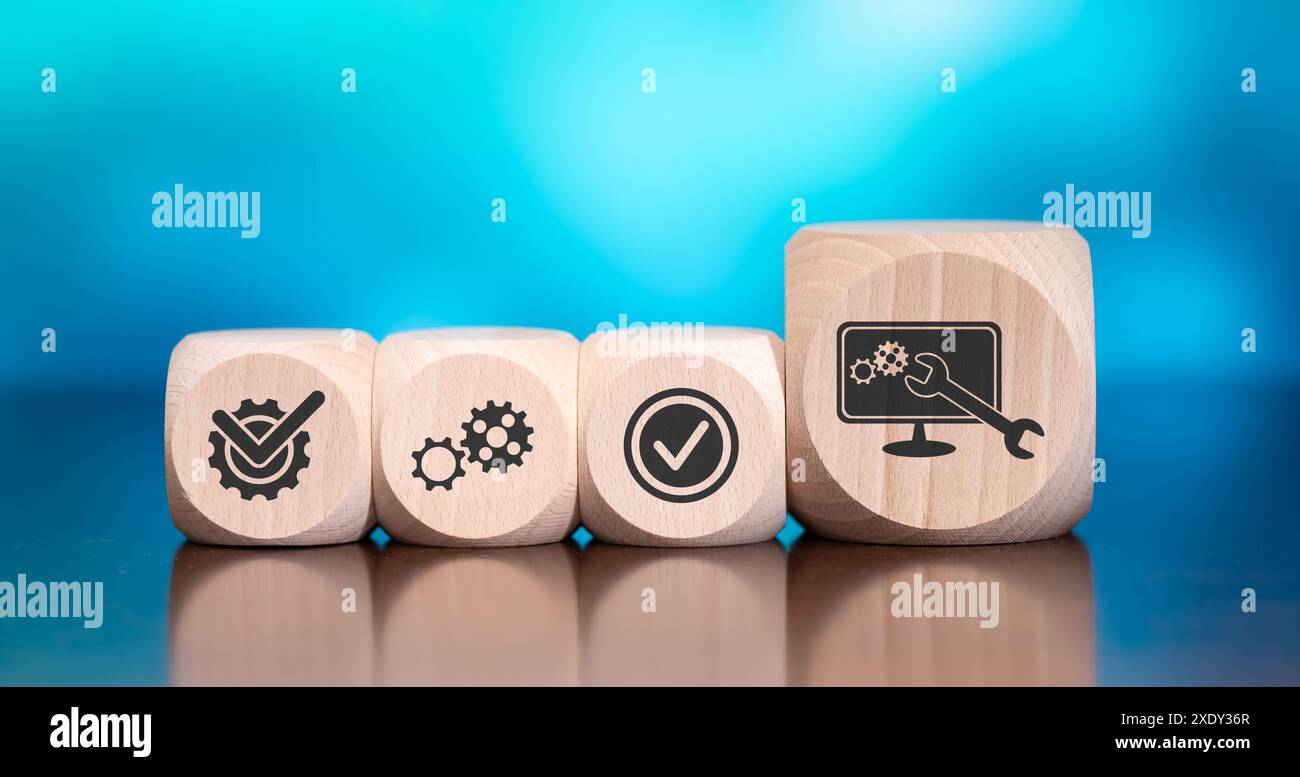 Wooden blocks with symbol of system maintenance concept on blue ...
