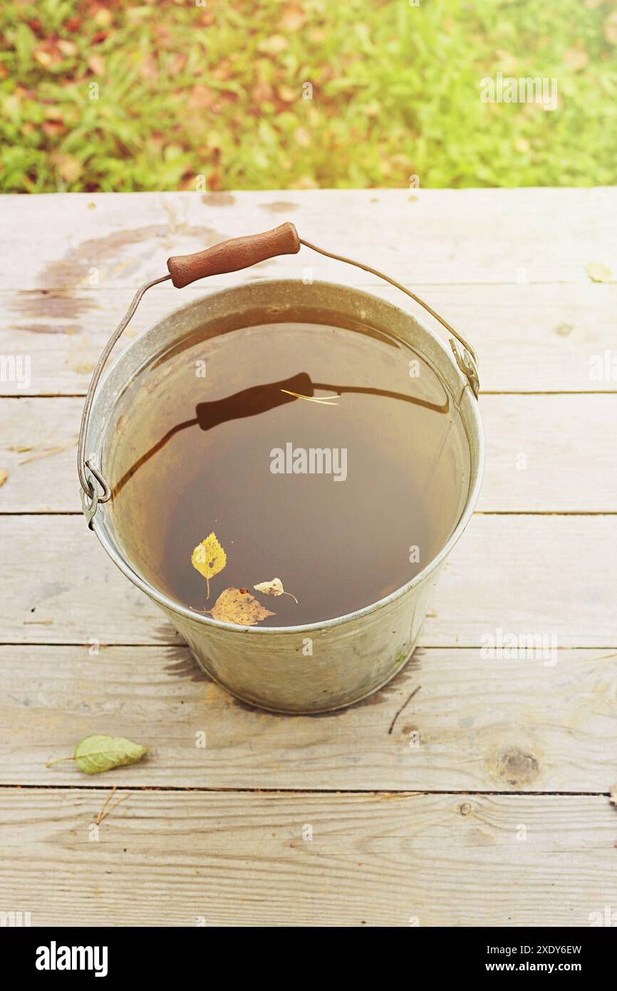 Rain water in the bucket Stock Photo - Alamy