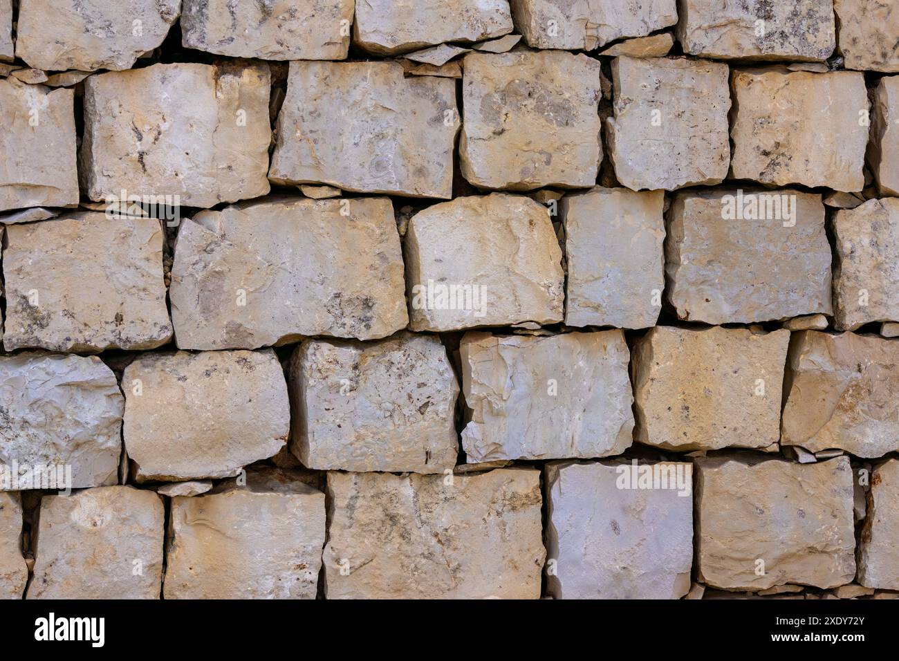 Square brick stone garden wall Stock Photo - Alamy