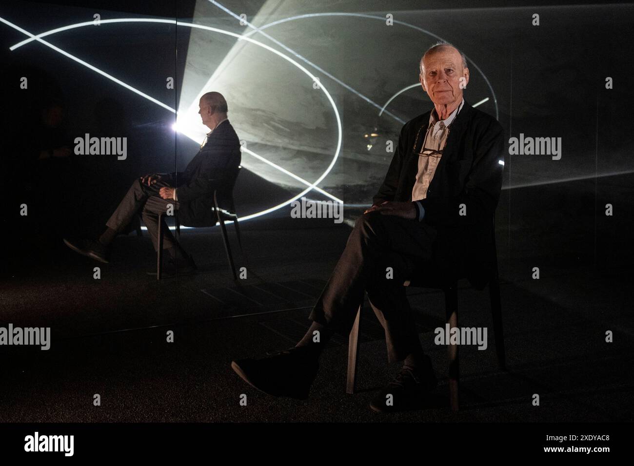 London, UK. 25 June 2024. Artist Anthony McCall in one of his immersive ...