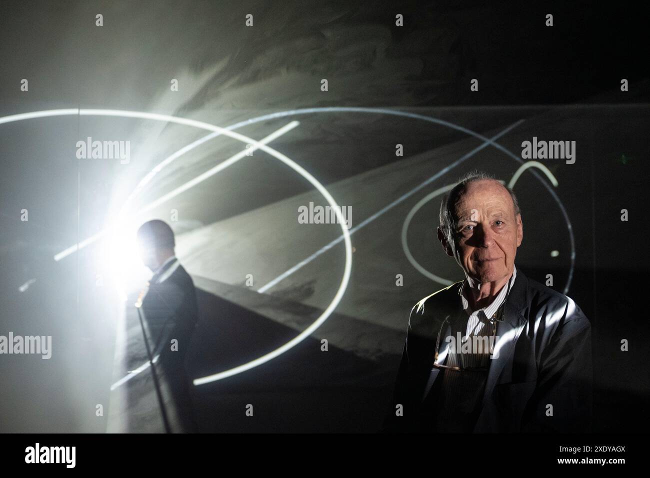 London, UK. 25 June 2024. Artist Anthony McCall in one of his immersive ...