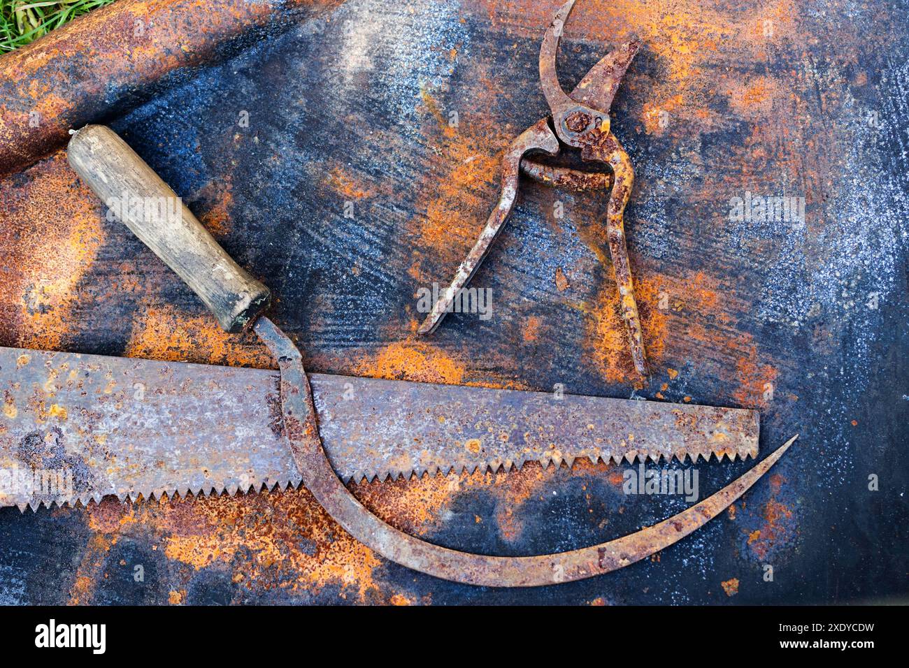 Rusty tools on the rusty sheet Stock Photo - Alamy