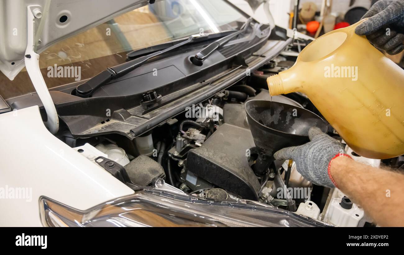 Mechanic fills hi-res stock photography and images - Alamy