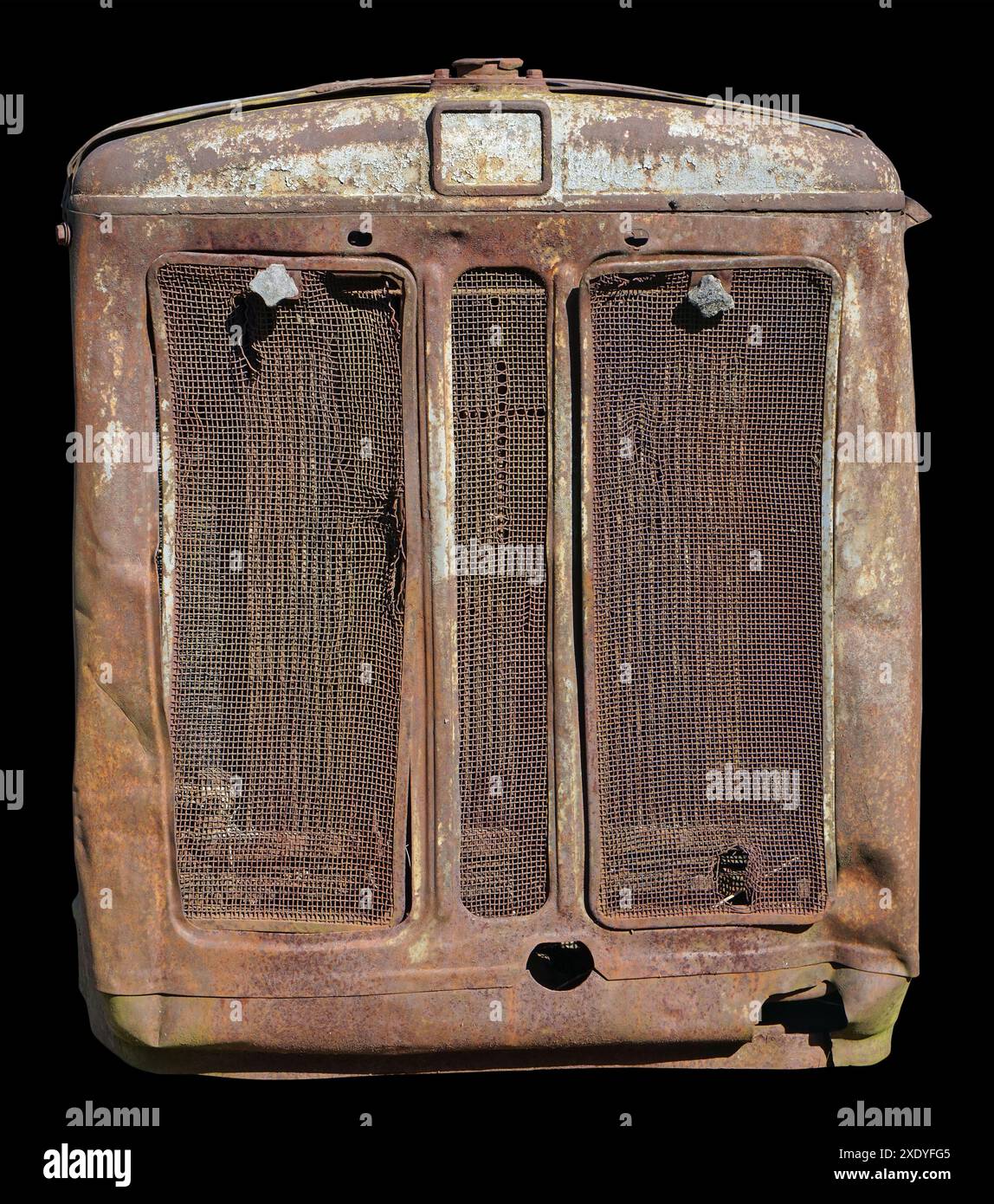Rusty front grille of a vintage farmer tractor of production of the ...