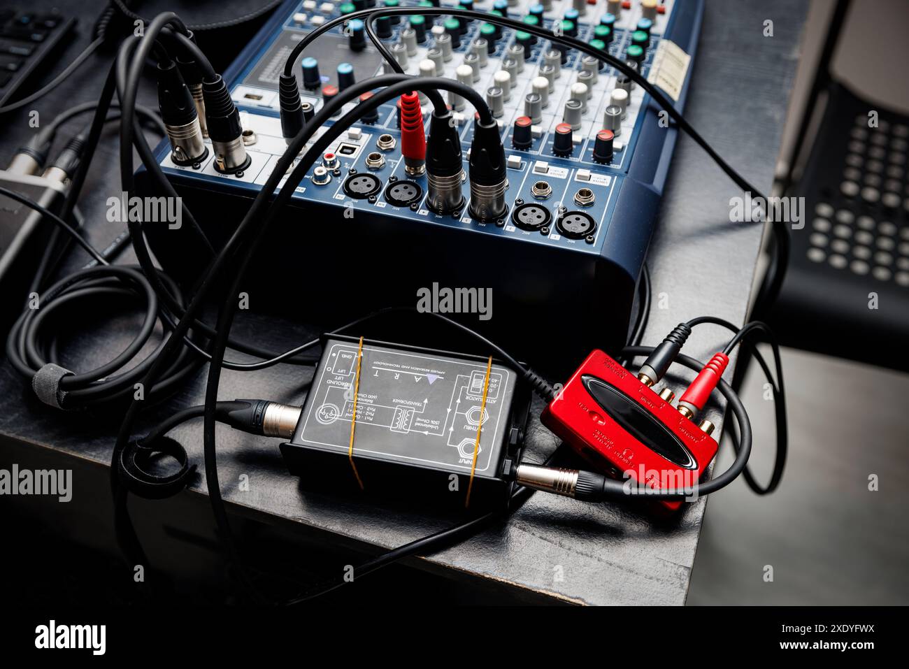 Professional Audio Gear Close-up: A detailed snapshot of a sound mixer and direct input boxes ...