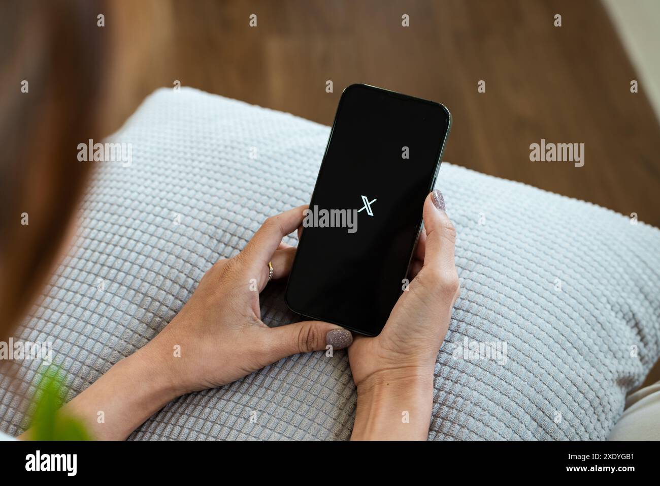 Chiang Mai, Thailand - JUN 25 2024: A female using X new twitter ...