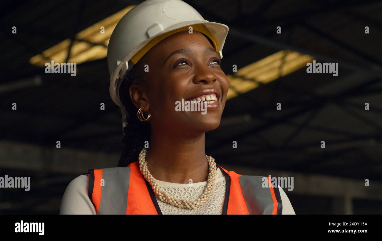 Smiling Black Female Engineer in Construction Site With Safety Gear and ...