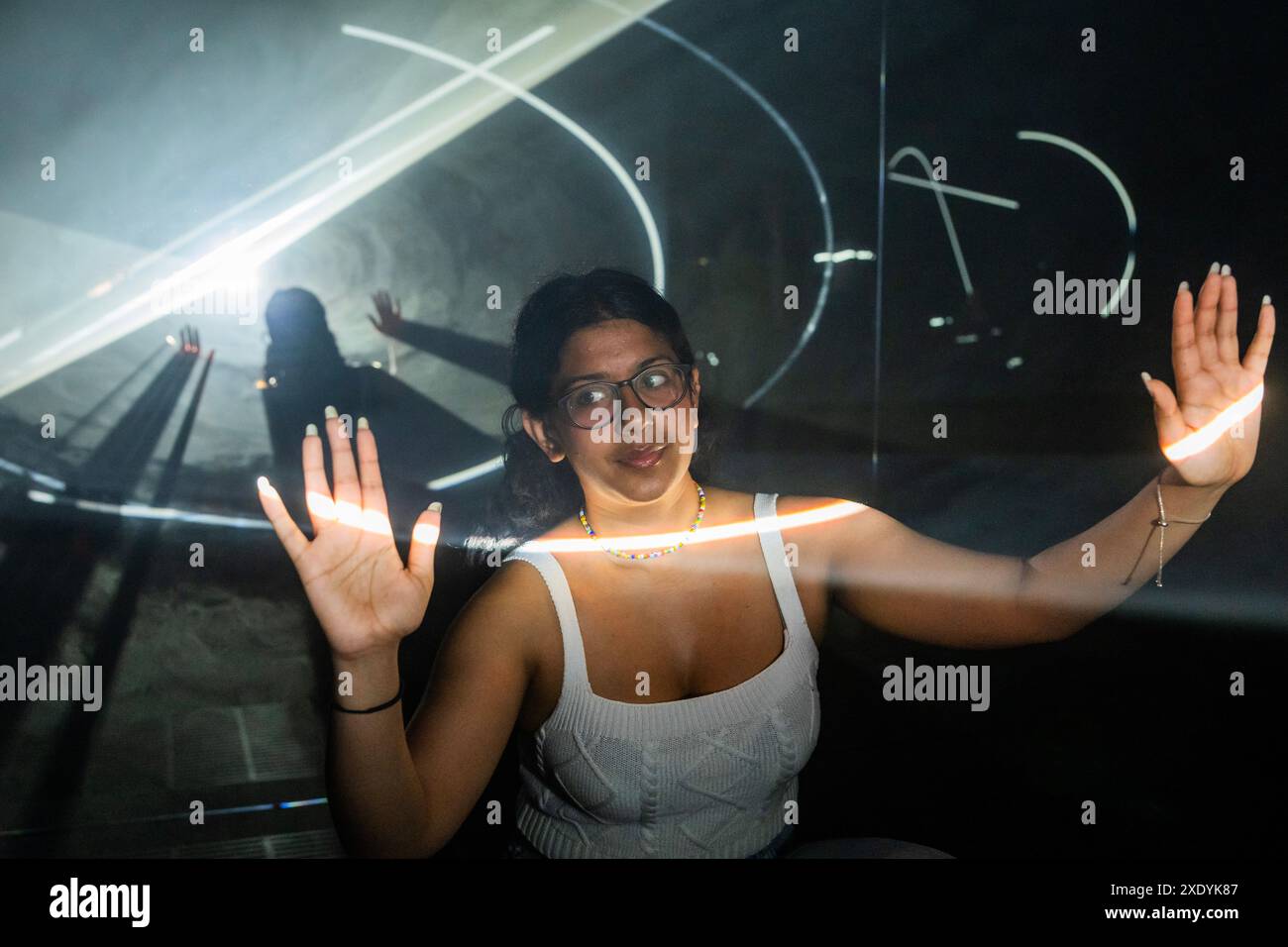 London, UK. 25 Jun 2024. Split-second (Mirror) I, 2018 - Anthony McCall: Solid Light at Tate ...