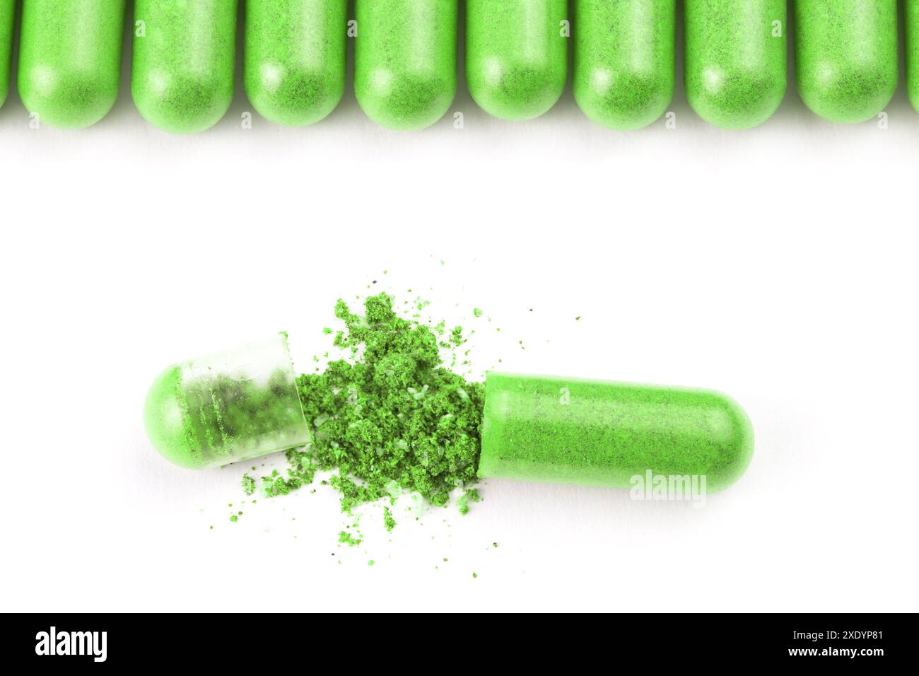 Row of ufo green color organic capsules isolated on white background ...