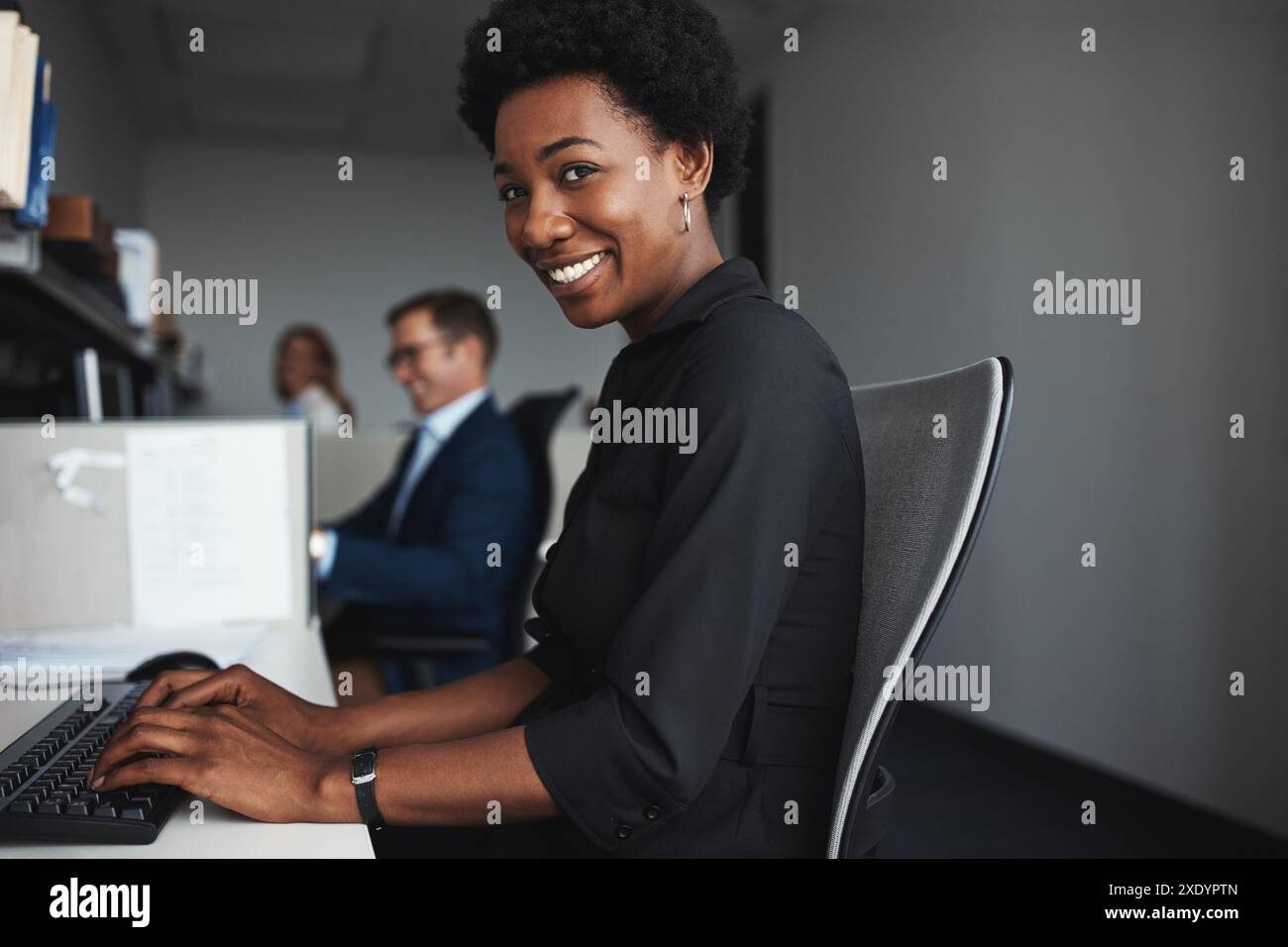 Office, cubicle and business woman in portrait with computer, typing email or daily operations ...