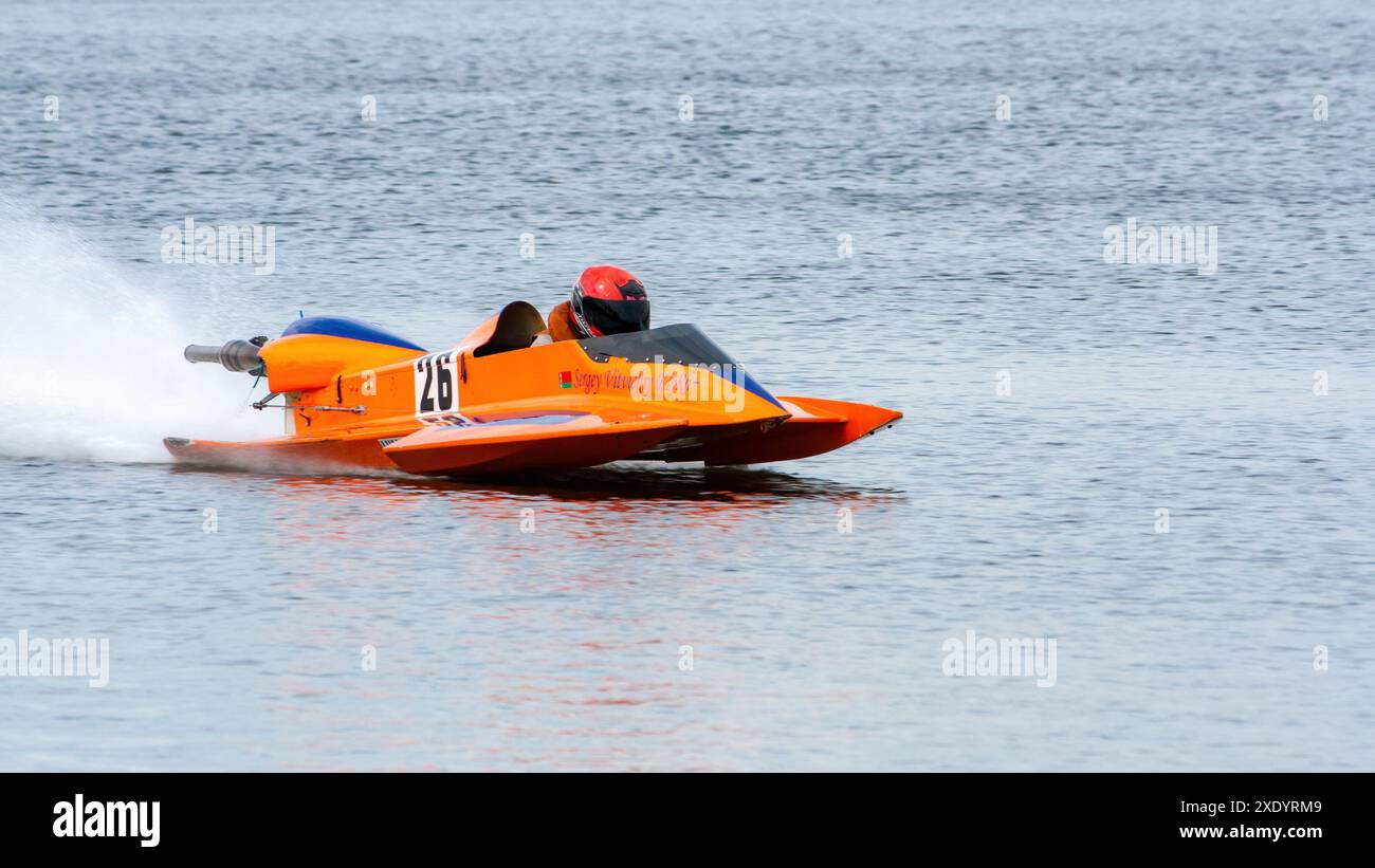 Close up view of bright hydroplane racing boat glides over the water ...