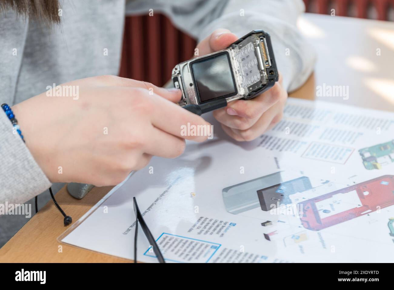 Old mobile phone recycling by technician - disassemble mobile phone ...