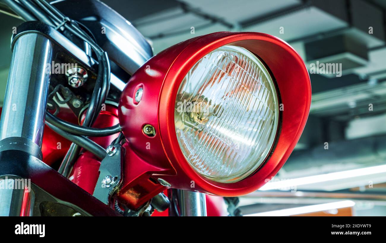 Front headlight of a red motorcycle Stock Photo - Alamy